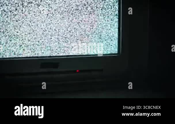 Close-up of a vintage CRT television screen displaying flickering ...