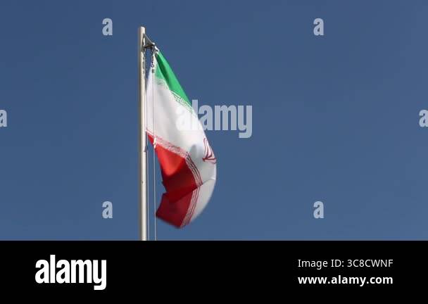 National flag of Iran on a flagpole Stock Video Footage - Alamy