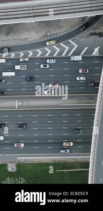 High-angle aerial top view of dense traffic flowing on multilayered ...