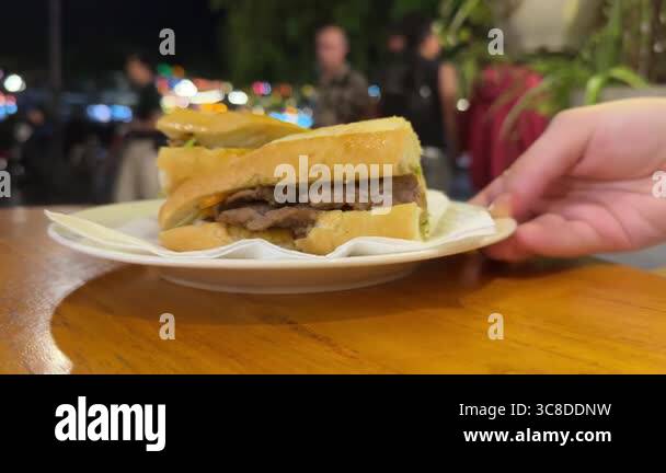 Banh mi bun, Vietnamese Meat Bun. On a white plate street food hand ...