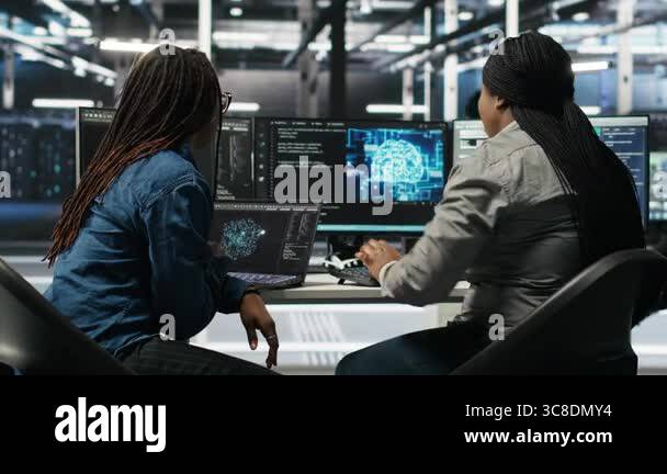 Data center coworkers doing brainstorming, using artificial intelligence machine learning models ...