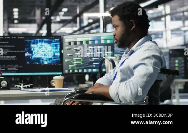 Engineer using wheelchair in data center using AI node tree software to ...