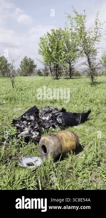 Shahed drone debris lying on green grass near a tree Stock Video ...