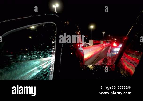 A captivating nighttime scene depicts a chaotic traffic jam adorned ...