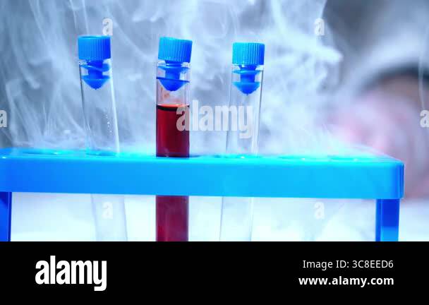 Test tubes with blood sample in dry ice macro close up 4k shot slow ...