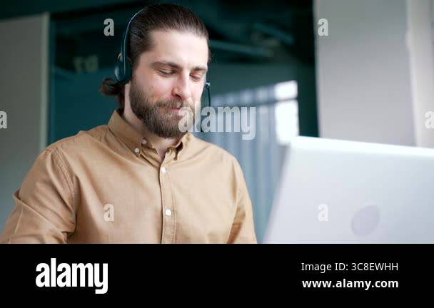 Corporate operator in headset working in customer support service on ...