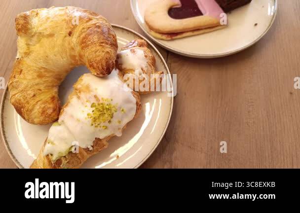 Friends savor freshly baked pastries while enjoying a bright morning at ...