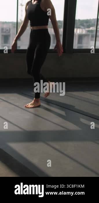 Vertical video. Sport class. Yoga studio. Group people training stretch ...