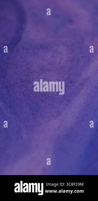 Vertical video. Blue overflow. Glitter wave. Purple liquid with marble ...