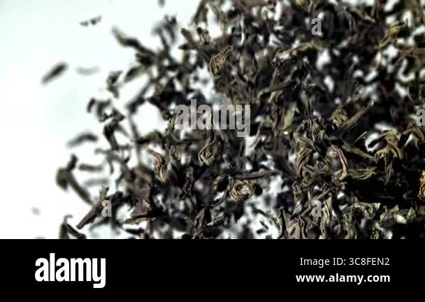 Dry tea flies up and down. Filmed on a high-speed camera at 1000 fps ...