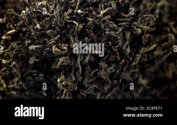 Dry tea flies up and down. Filmed on a high-speed camera at 1000 fps ...