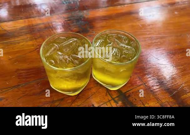 green iced tea Ice cubes Fresh lemonade in wet glass with slice of ...