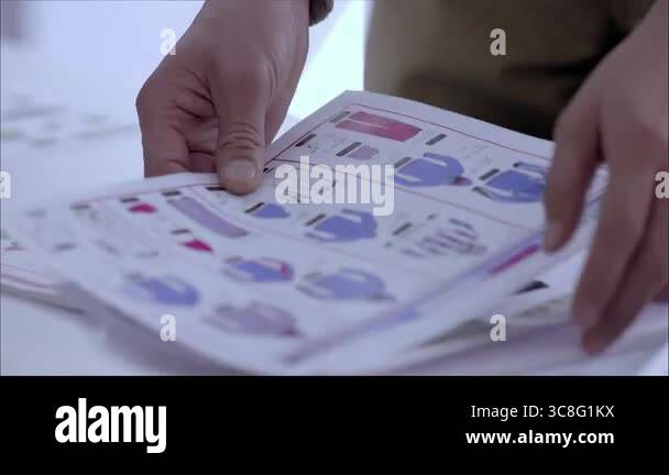 Arranging and checking the clothing design manuscript, close-up of the ...