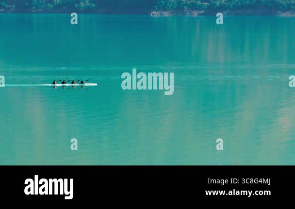 Rishikesh, India January 24, 2025: Four men are seen rowing a kayak in ...