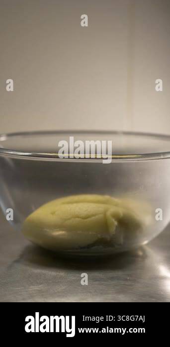 Step-by-step eclair recipe with hot choux pastry dough in transparent ...