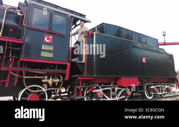 The old steam locomotive, like a museum exhibit, decorates the platform ...