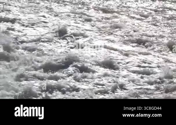 Surging waters in a swollen river after a torrential rain, In slow ...