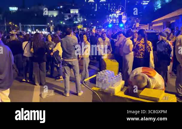 Tbilisi, Georgia - 9th May, 2025: Crowds waving EU and Georgian flags ...