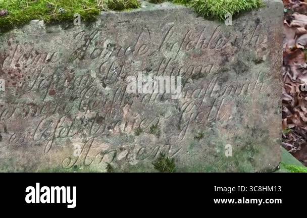 Cesis, Latvia - October, 12, 2024 - Close-up of weathered gravestone ...