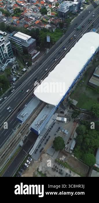High-angle shot of an MRT station, highway traffic, and surrounding ...