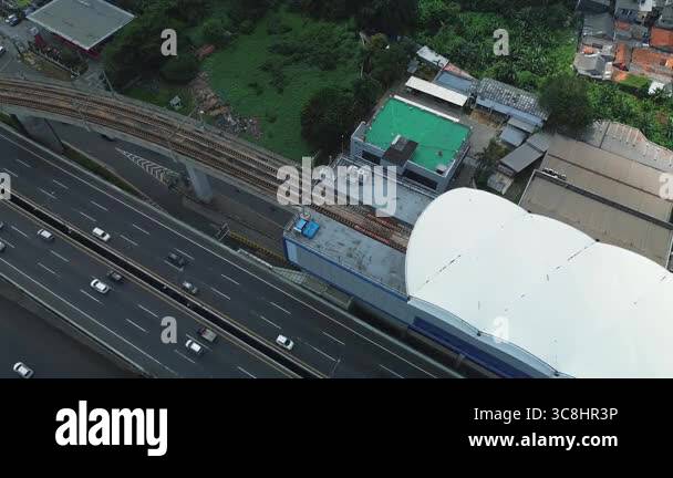 High-angle view of an MRT station, highway, and surrounding urban ...