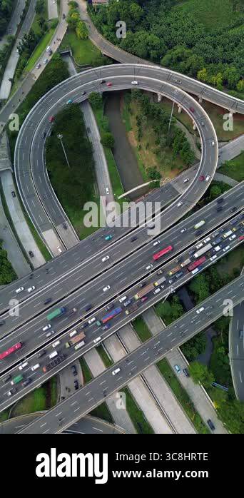 Overhead shot of a complex highway interchange with heavy traffic flow ...