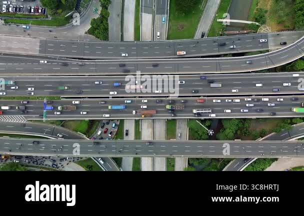 Overhead drone shot of a multi-lane highway intersection with heavy ...
