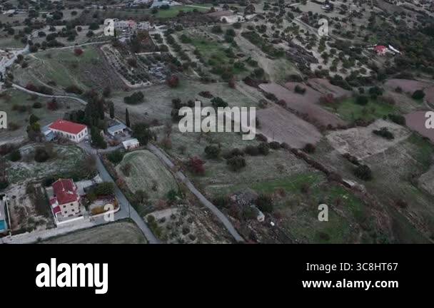 Aerial view of Lefkara village with homes, roads and greenery ...
