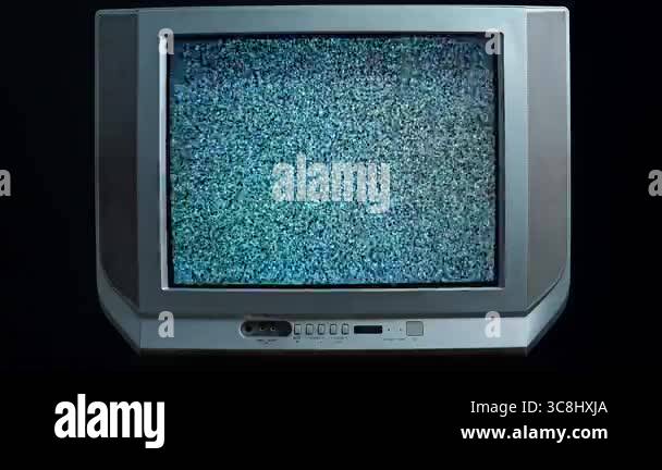 A vintage television set displaying a classic black and white static ...