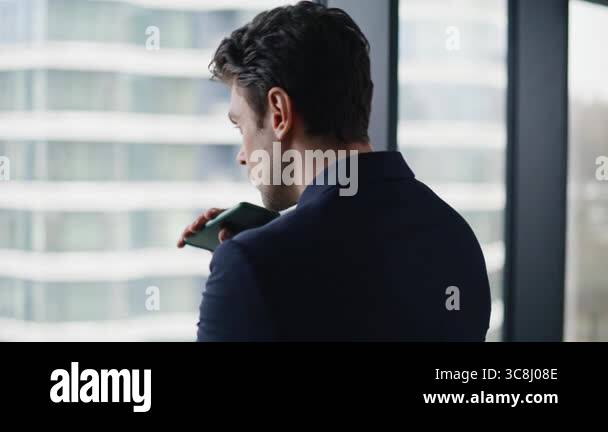 Pensive manager gazing out high-rise office window closeup. Portrait ...