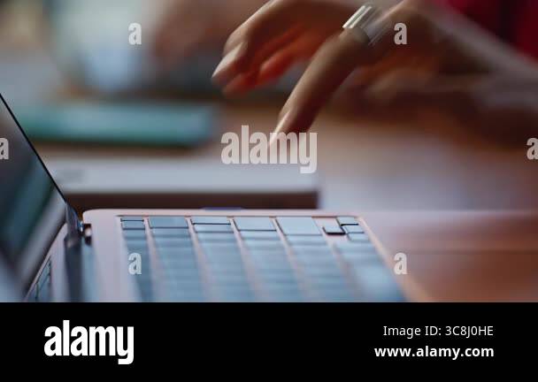 Employee hand turning on laptop online app at office coworking space ...