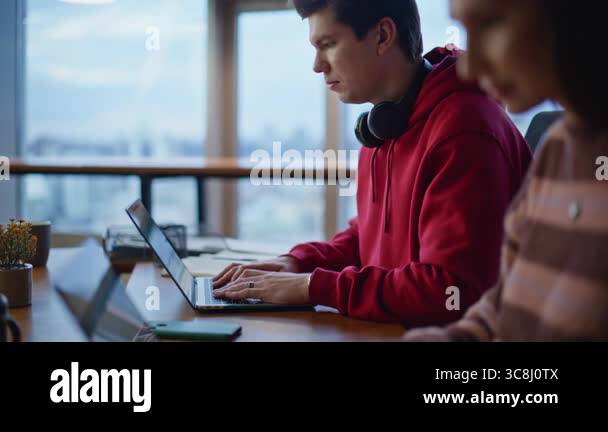 Company staff working computers at modern coworking space closeup ...