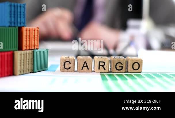 Cargo word on wooden cubes with miniature intermodal containers and ...