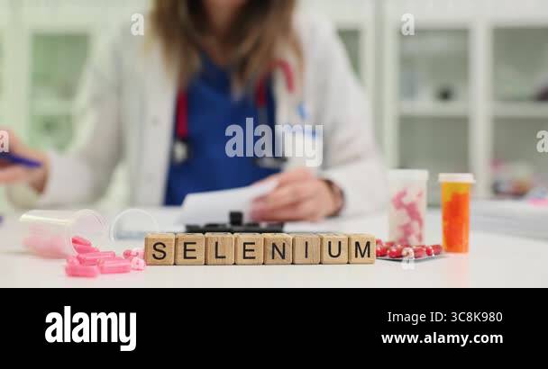 Female doctor writes prescription for supplements near cubes with ...
