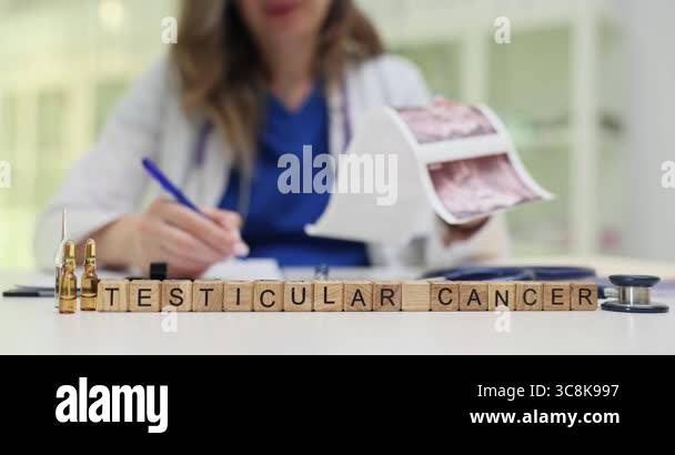 Text Testicular Cancer of wooden blocks and doctor holding ultrasound ...