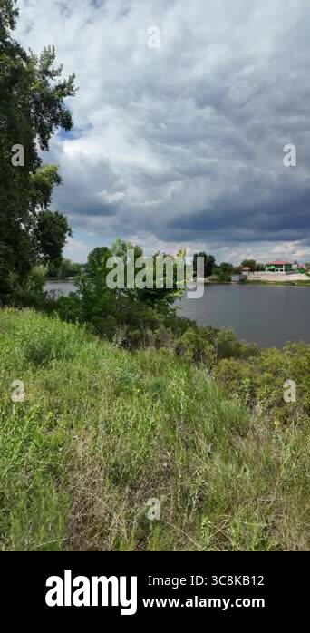 Landscape with river and gloomy sky. Slow motion video nature landscape ...