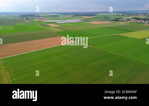 Aerial view of Bavarian farmland in Germany during summer. Green fields ...