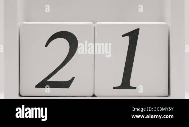 Close-up of the number 21 displayed on white blocks. Ideal for concepts ...