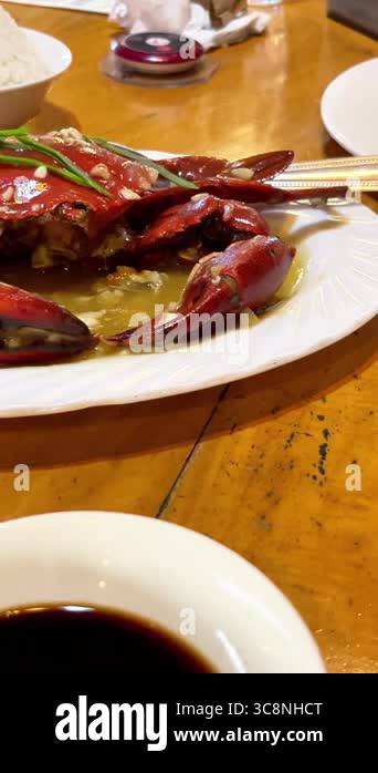 grilled tuna steak and cooked crab on a plate in a restaurant Stock ...