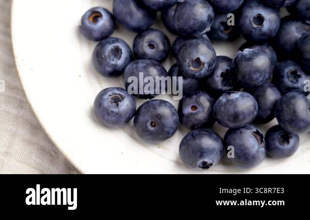 Freshly picked blueberries on a kitchen plate. Organic bilberry. Top ...