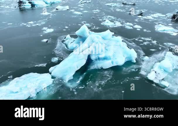 Cinematic drone view of the sharp ice ridges of glacier blue ice ...