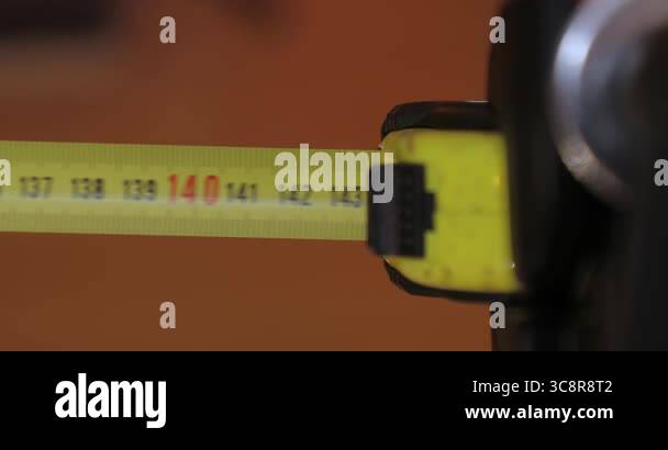 Using measuring tape to check sizes of furniture, home interiors Stock ...