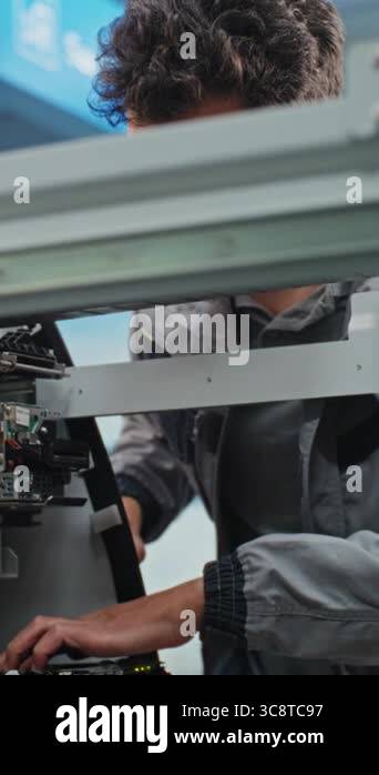 ATM Technician in Uniform Performing Maintenance of Cash Dispenser ...