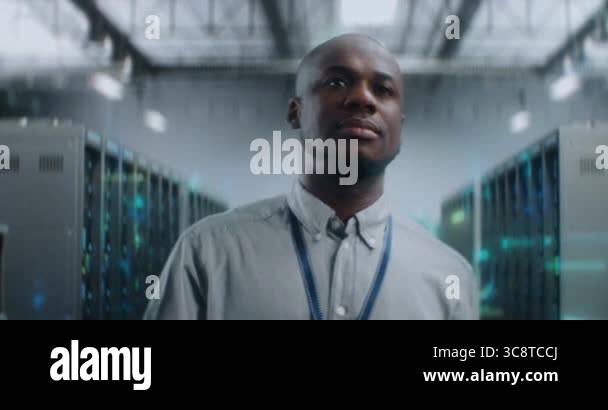 African American Administrator Walking in Futuristic Big Data Center ...