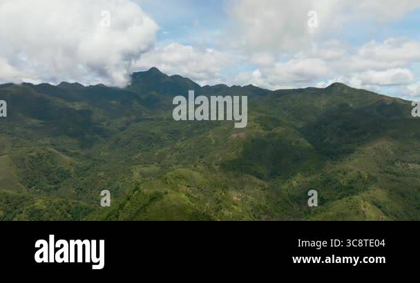 Aerial view of tropical mountain range and mountain slopes with ...