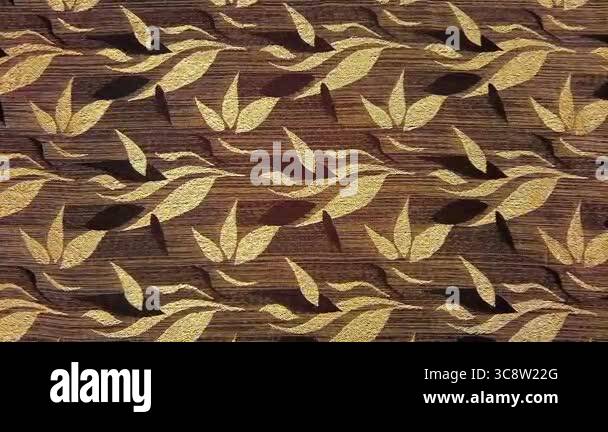 Textile fabric swirled moving background with a repeating leaf pattern ...