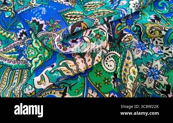 Paisley patterned fabric detail swirled rotating background, featuring ...