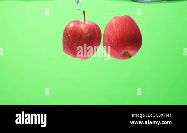 Underwater View of Falling Red Apples. Fruits in Water Slow Motion ...