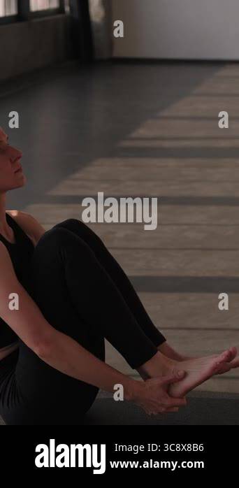 Vertical video. Gymnastic practice. Pilates exercise. Fit sport woman ...