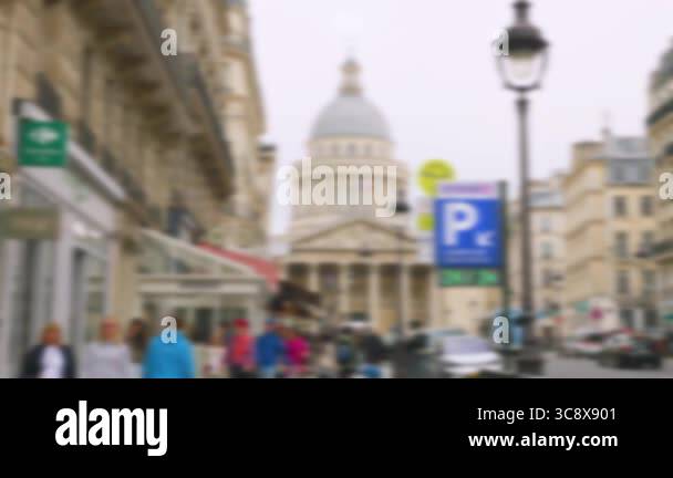 People walking along Rue Soufflot with the Pantheon building in the ...